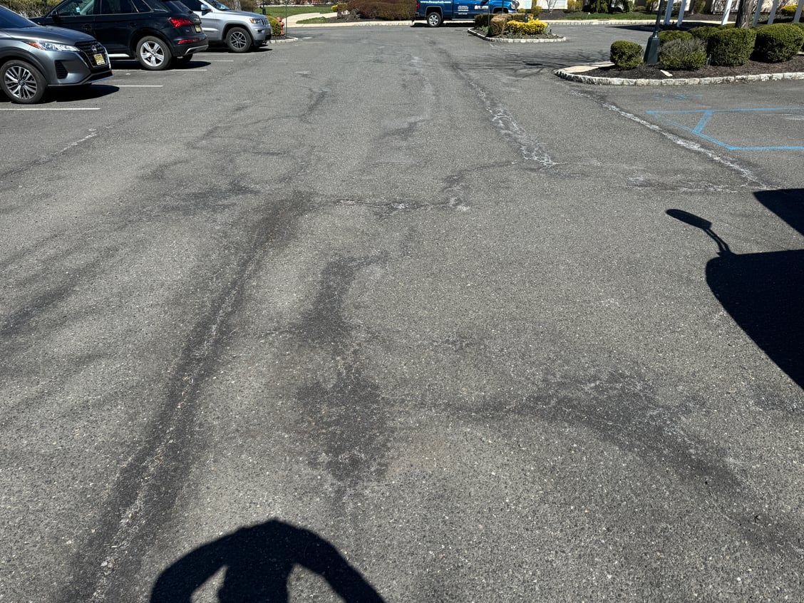 Causes of White Stains in Asphalt Parking Lots
